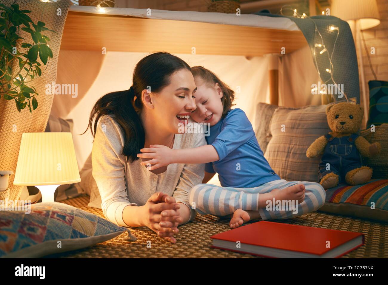 Happy loving family. Young mother and her daughter girl playing in kids ...