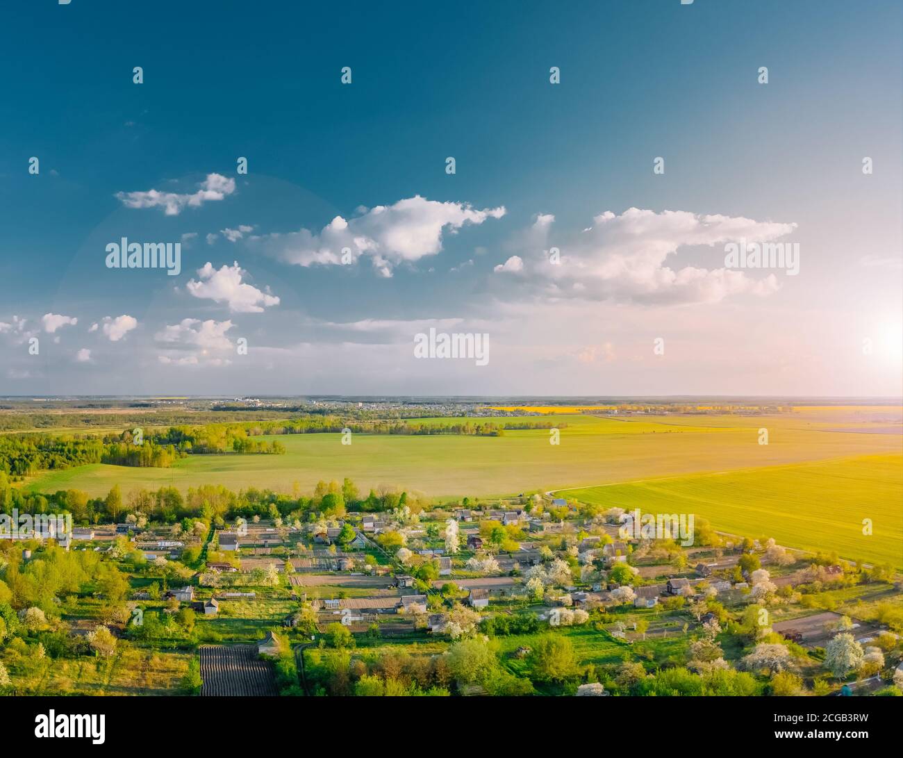 Summer cottage village landscape under blue sky with green fields Stock ...