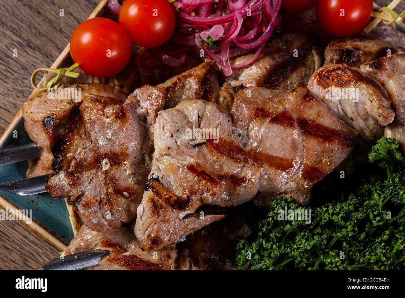 Grilled chicken and pork barbeque Stock Photo - Alamy