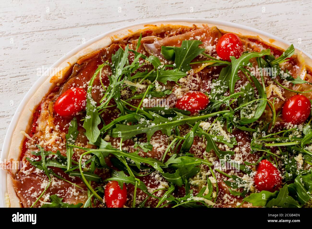 Pizza with hamon and ruccola Stock Photo - Alamy