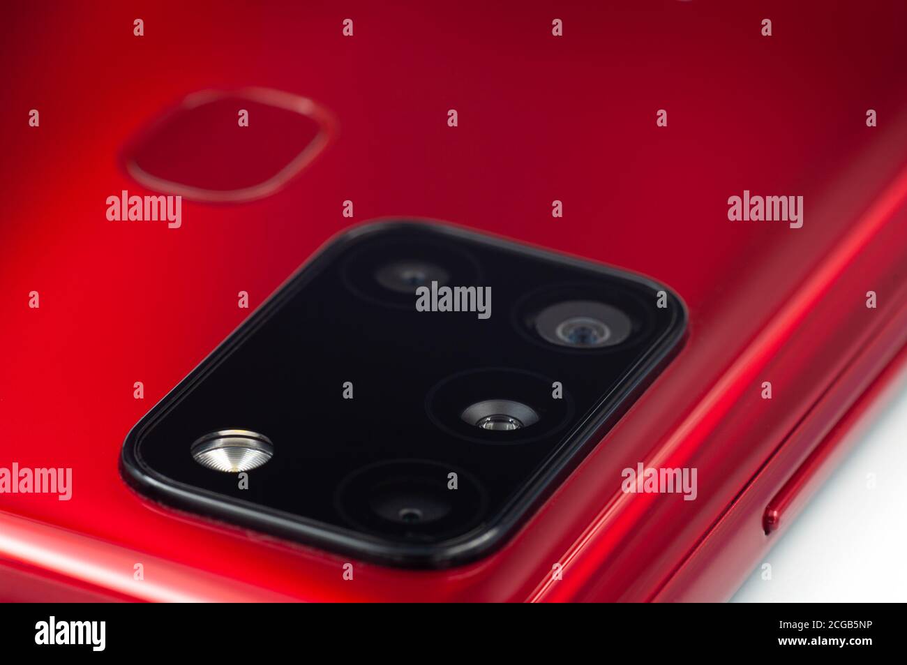 Red modern smart phone multi camera lens and fingerprint scanner close ...