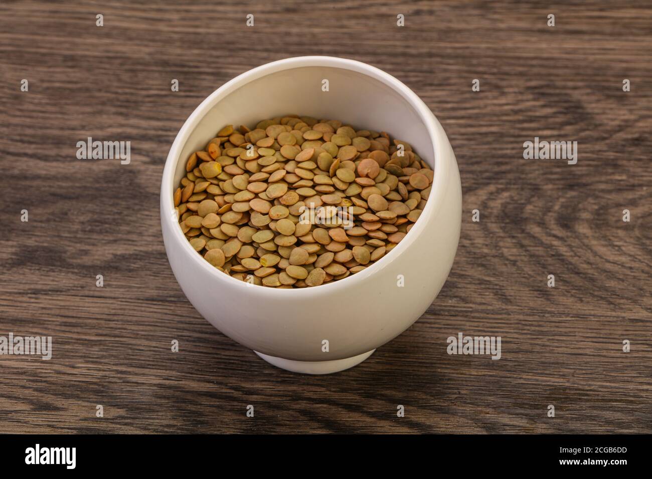 Vegan cuisine - Dry lentil heap isolated Stock Photo - Alamy