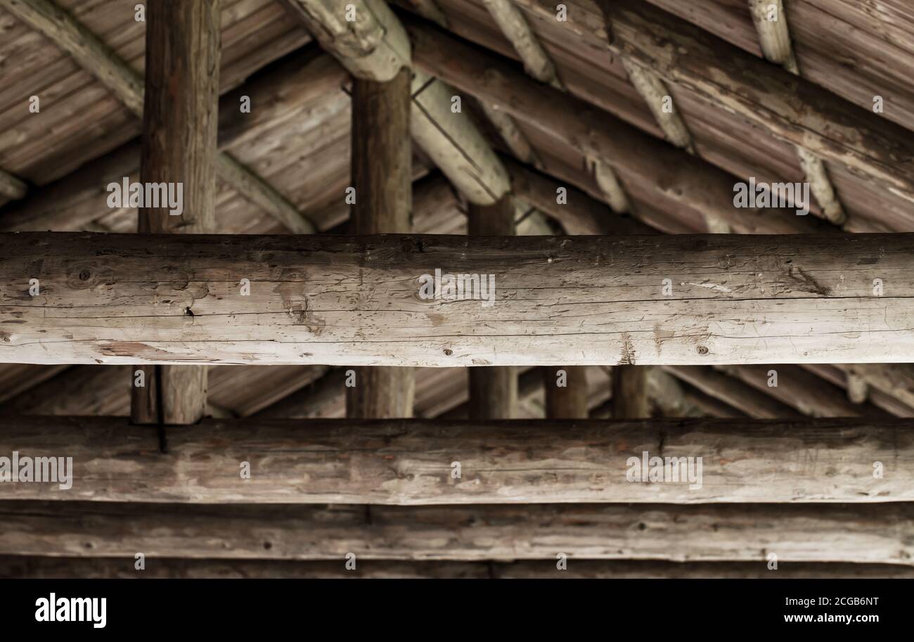 Wooden roof details. Rough logs and boards Stock Photo - Alamy