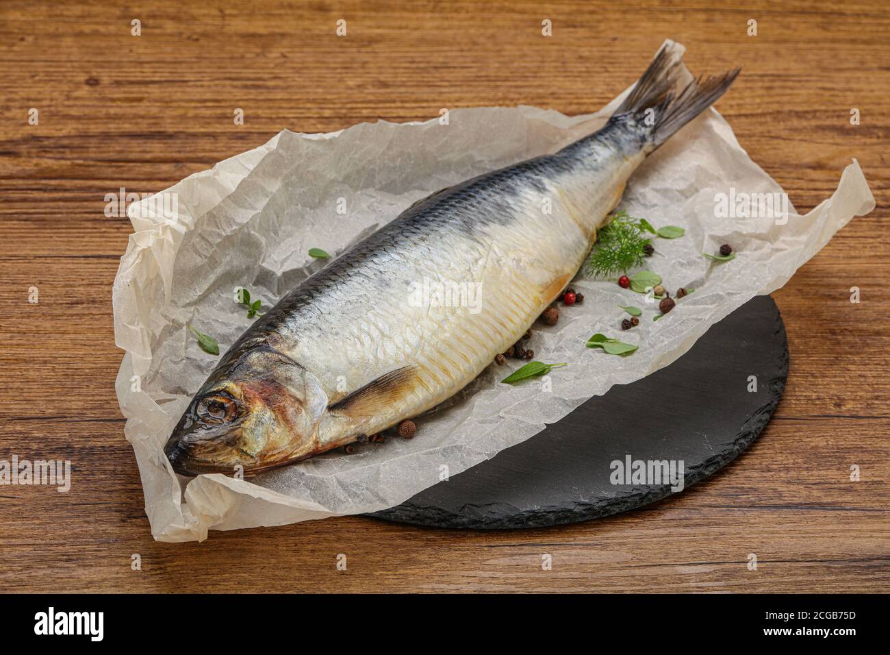 Salted Herring fish with pepper and spices Stock Photo - Alamy