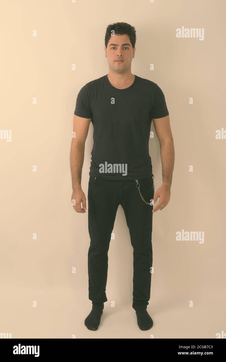 Young handsome Persian man against white background Stock Photo - Alamy