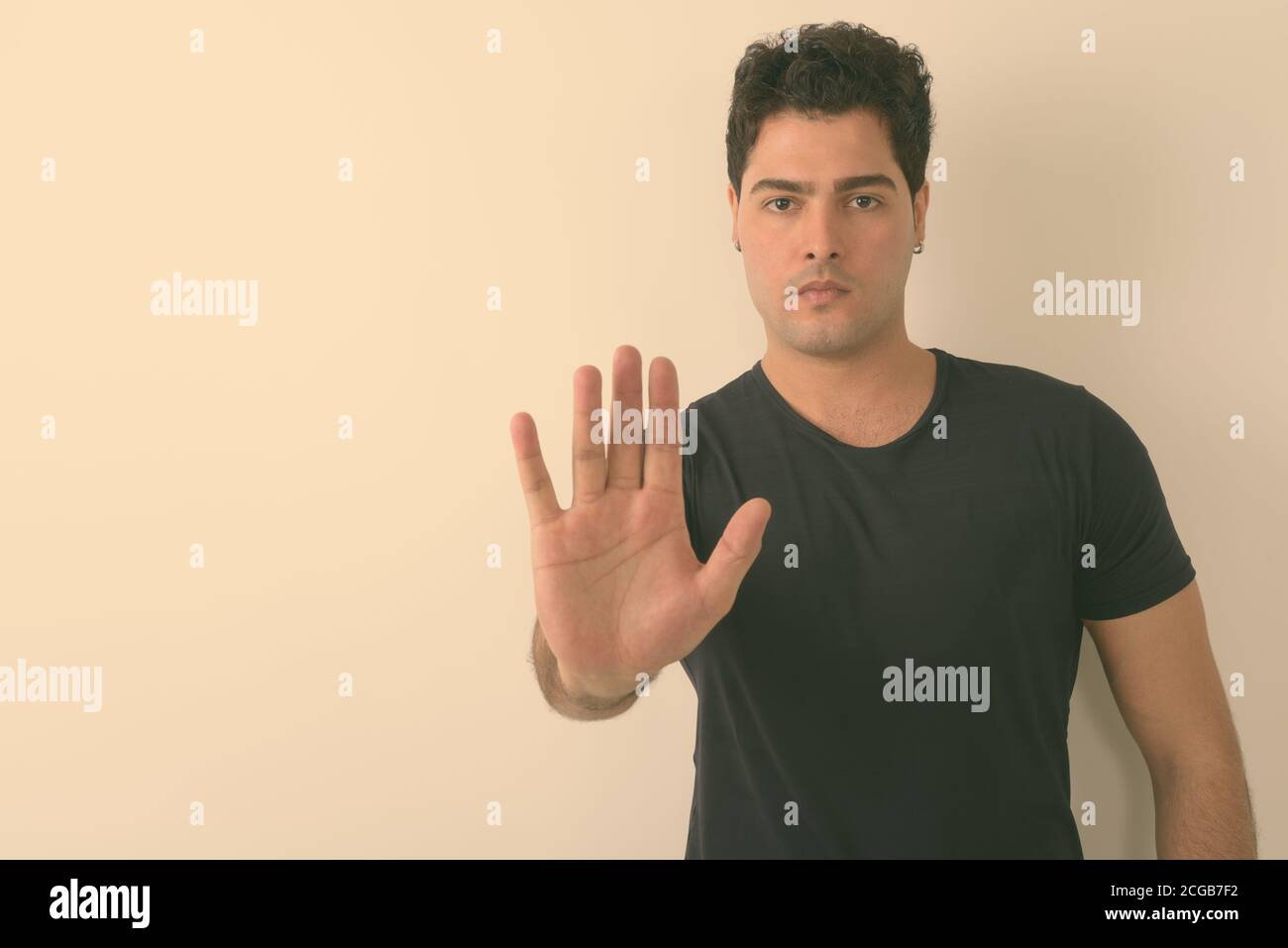 Young handsome Persian man against white background Stock Photo - Alamy