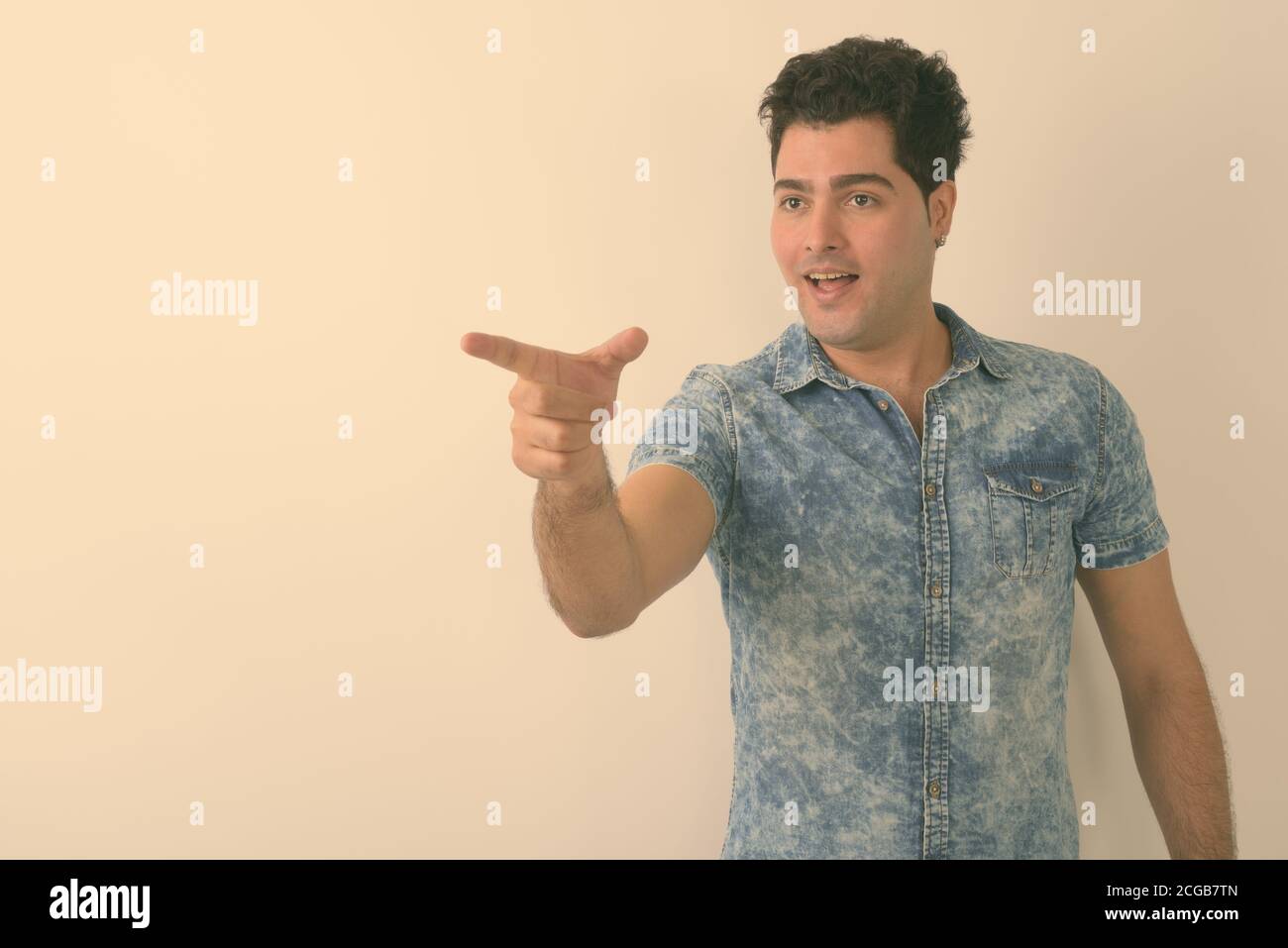 Young handsome Persian man against white background Stock Photo - Alamy