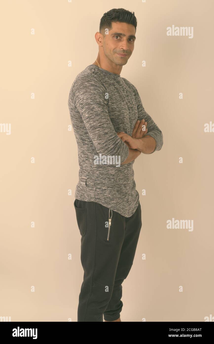 Young muscular Persian man against white background Stock Photo - Alamy