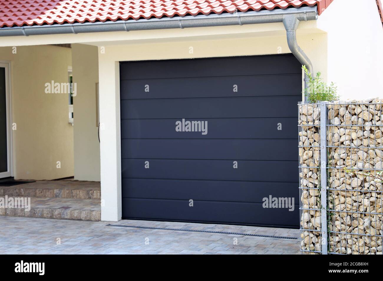 Modern new garage door (sectional door Stock Photo - Alamy