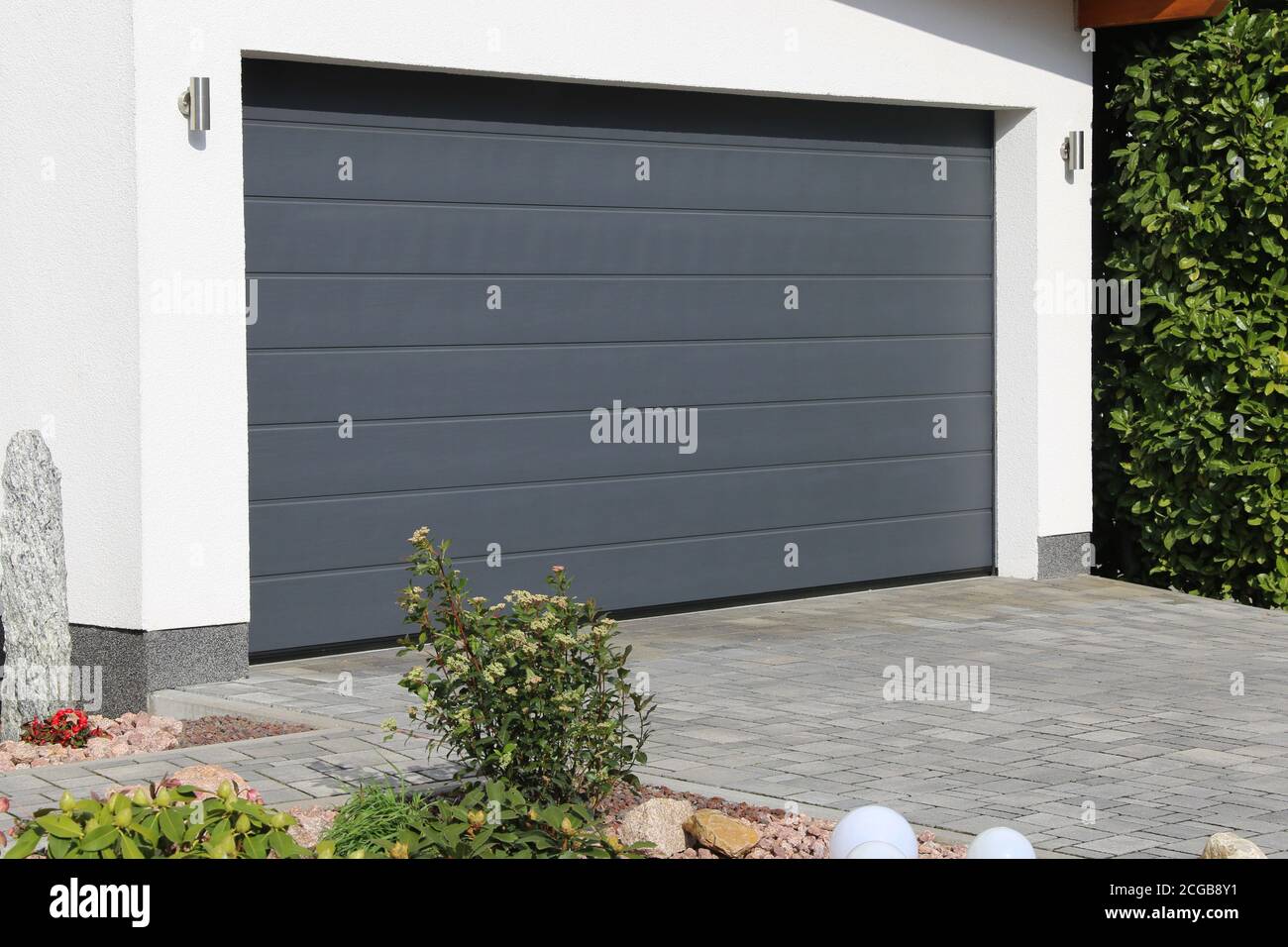 Modern new garage door (sectional door Stock Photo - Alamy