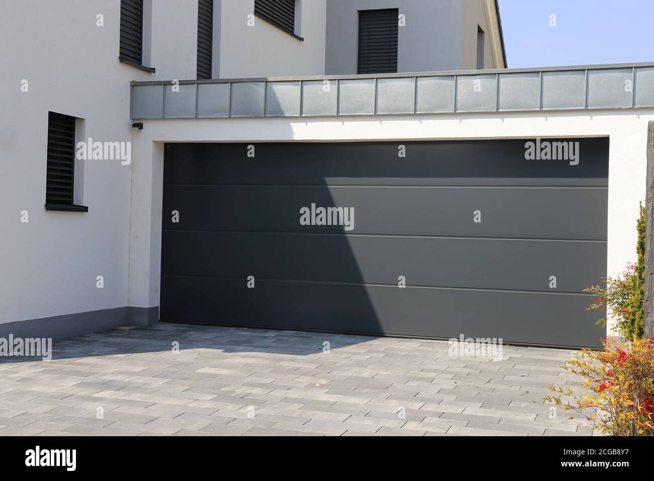 Modern new garage door (sectional door Stock Photo - Alamy