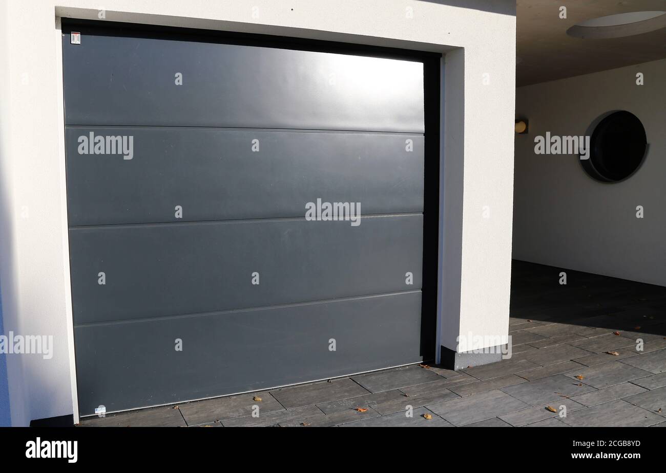 Modern new garage door (sectional door Stock Photo - Alamy