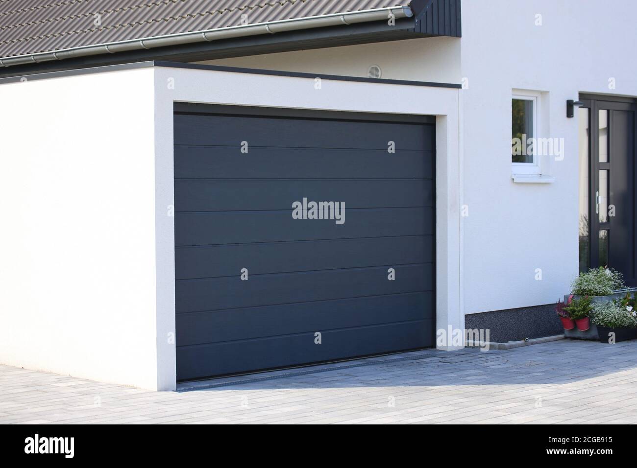 Modern new garage door (sectional door Stock Photo - Alamy
