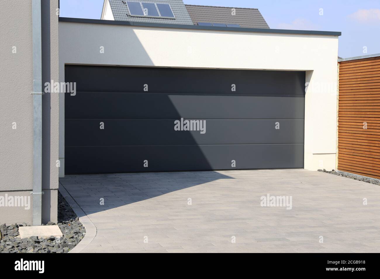 Modern new garage door (sectional door Stock Photo - Alamy