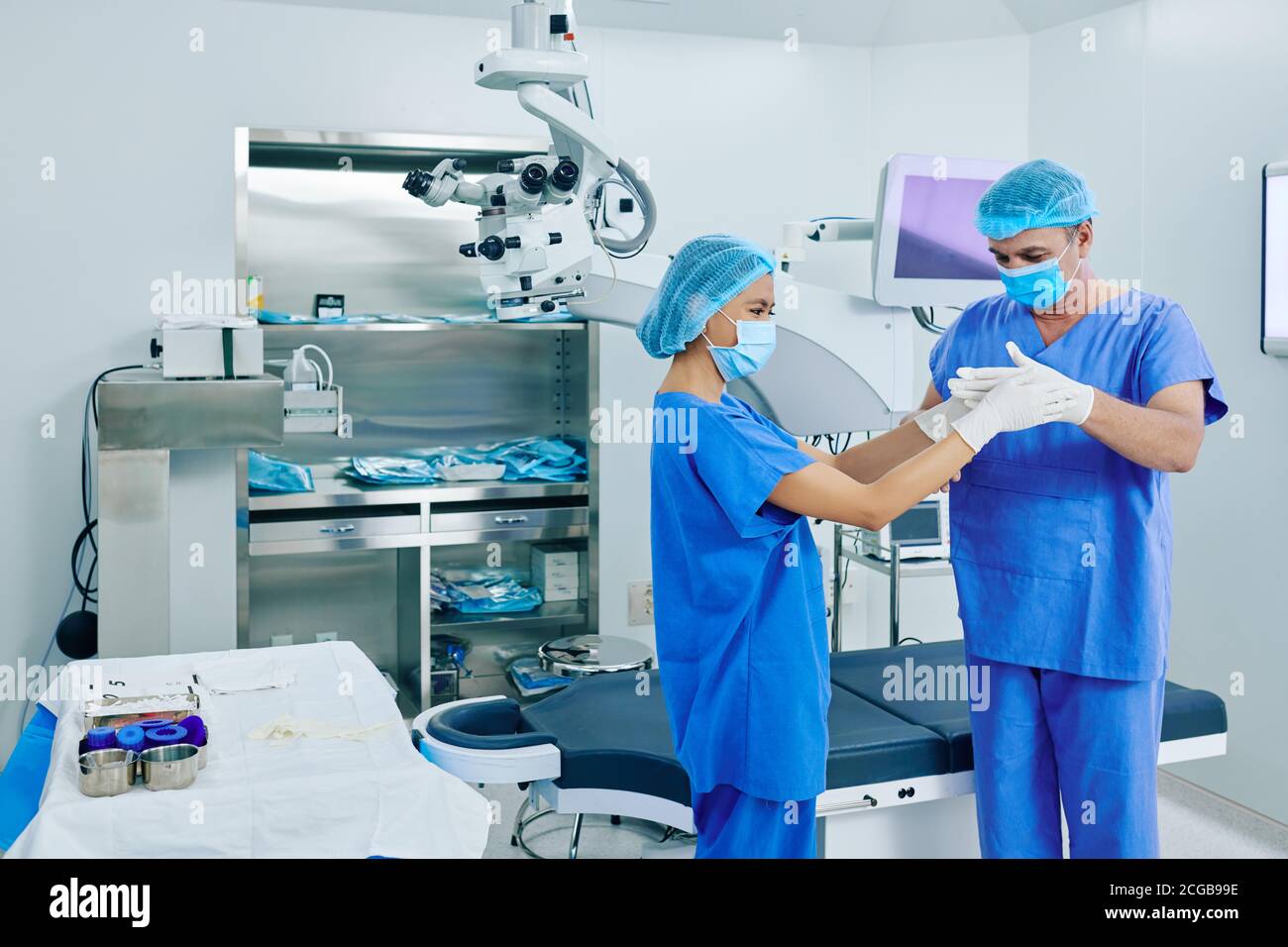 Surgeon and nurse in operating room Stock Photo - Alamy