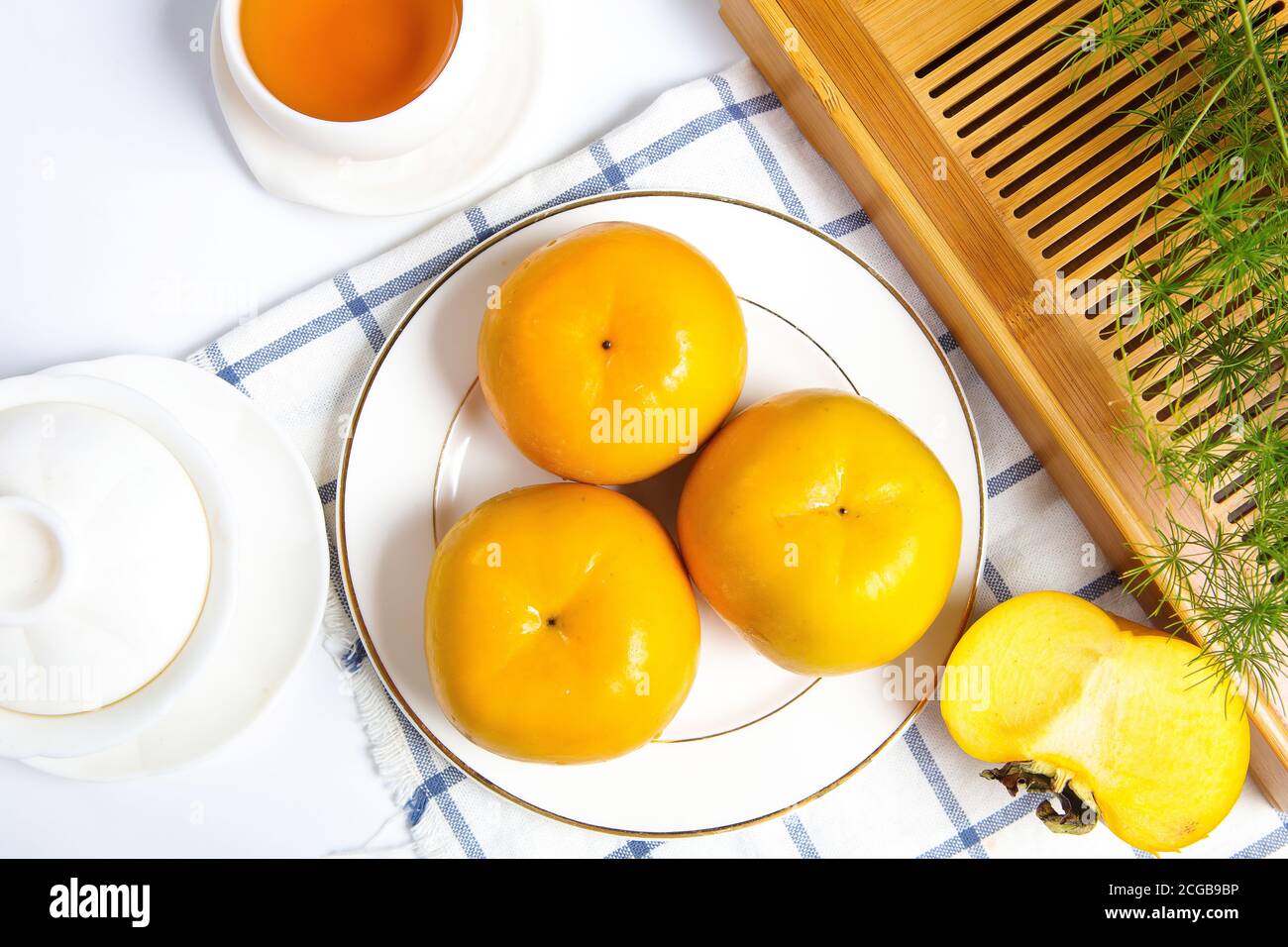 Persimmon drink nutrition afternoon tea Stock Photo - Alamy