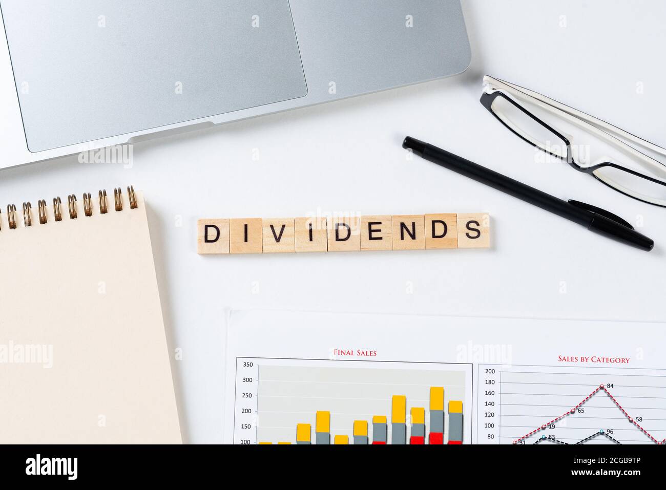 Dividends payment concept with letters Stock Photo - Alamy