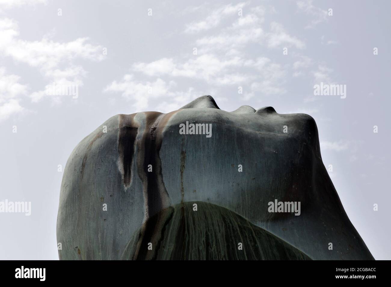 ALESSANO - Sculpture of a face on the central square Stock Photo - Alamy