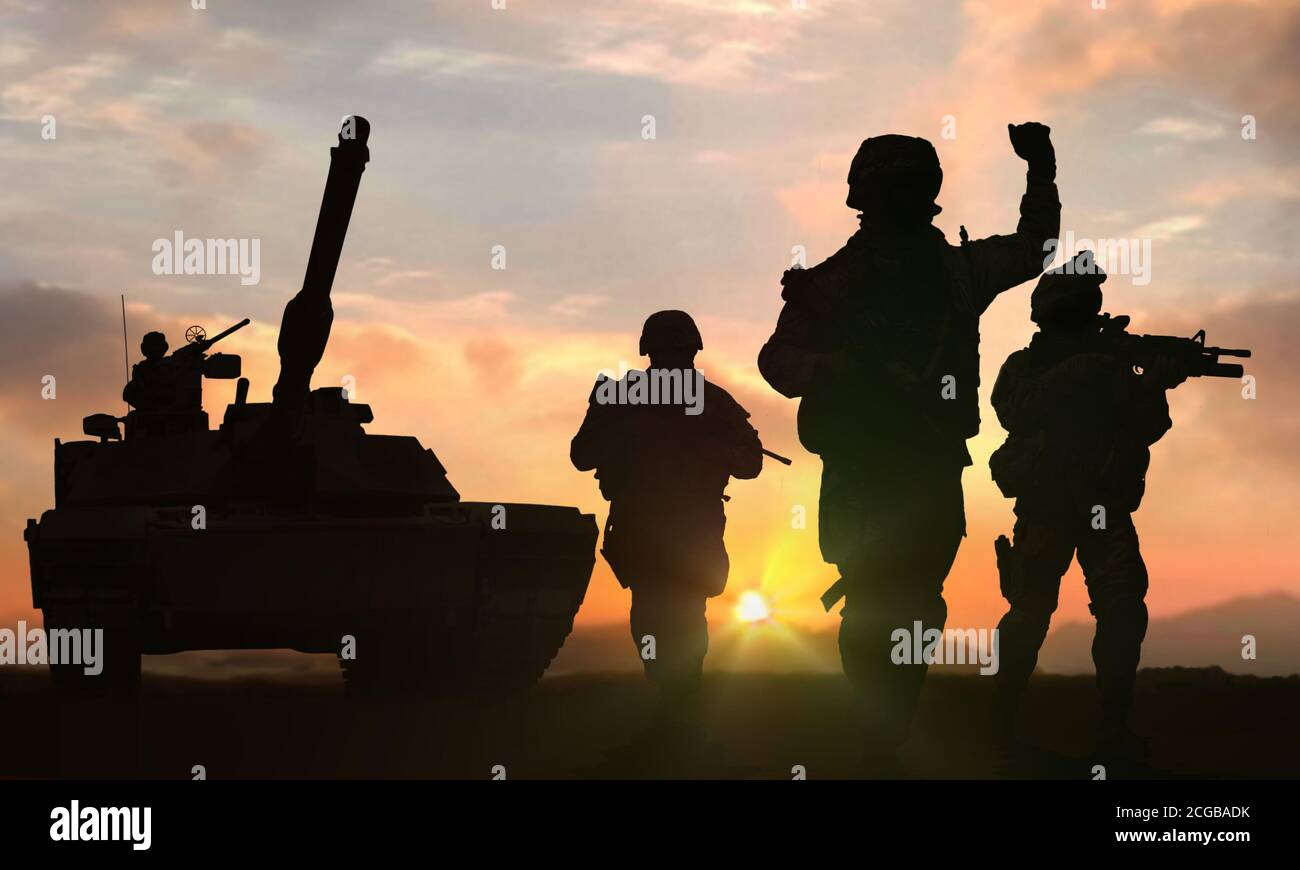 Soldiers and tank on battlefield at sunset Stock Photo - Alamy