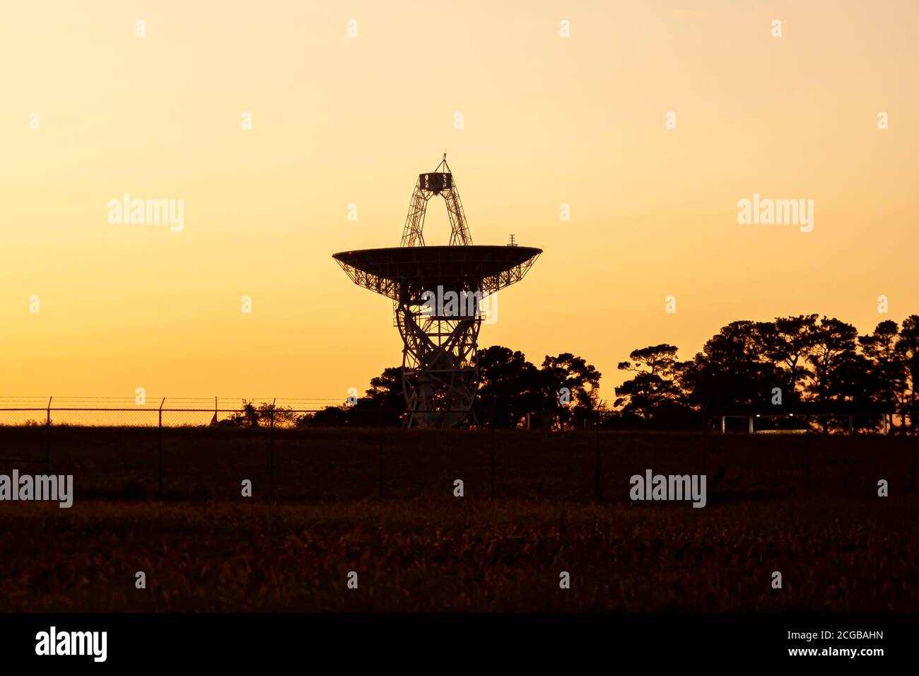 Close up isolated silhouette image of a large radio telescope antenna ...