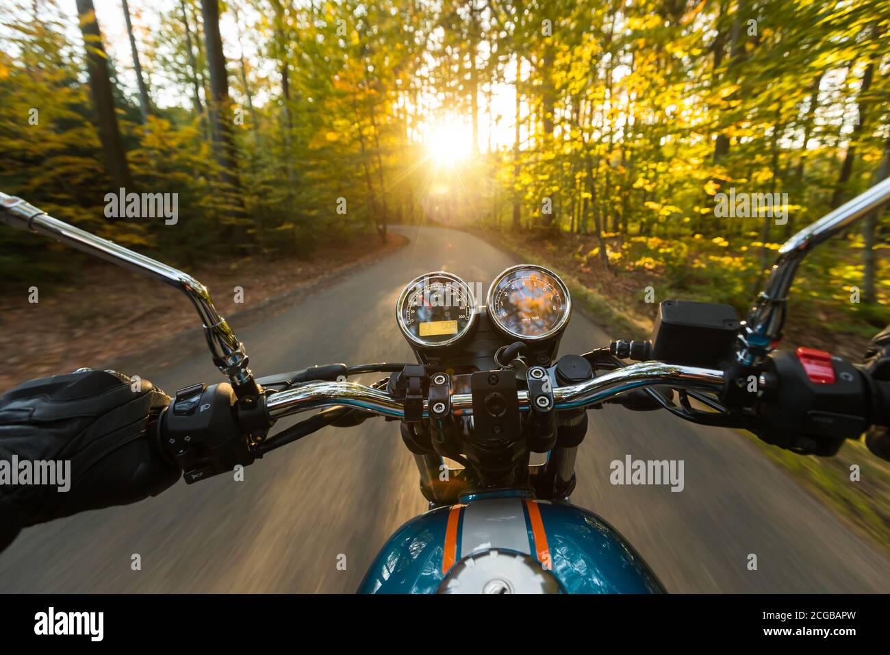 View from motorcycle driver perspective riding in foreste landscape ...