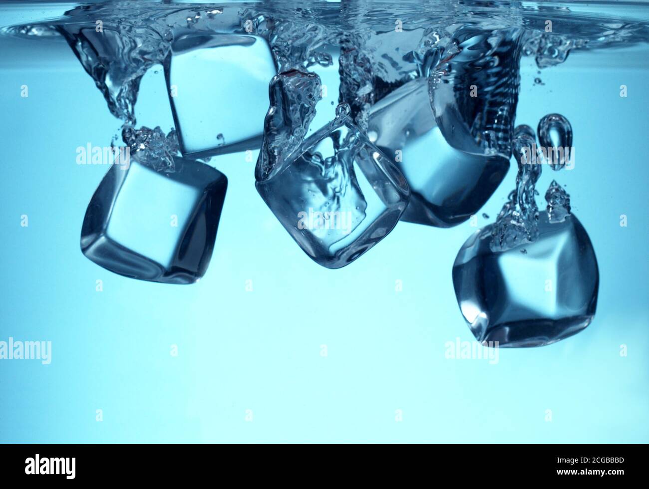 Group of ice cubes falling in water. Refreshment and drink concept ...
