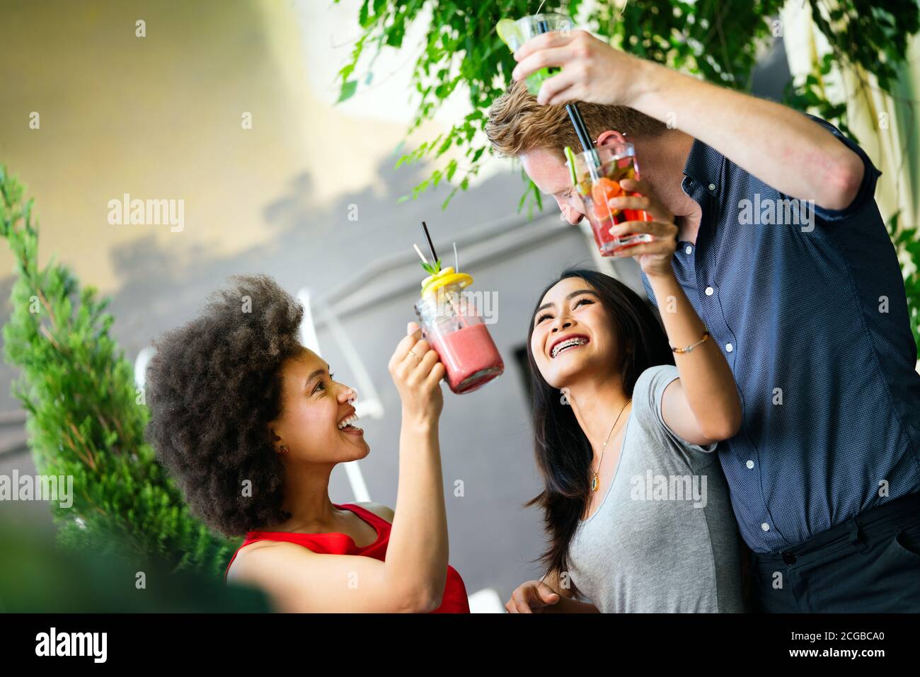 Young friends having a great time together. Group of people talking and ...