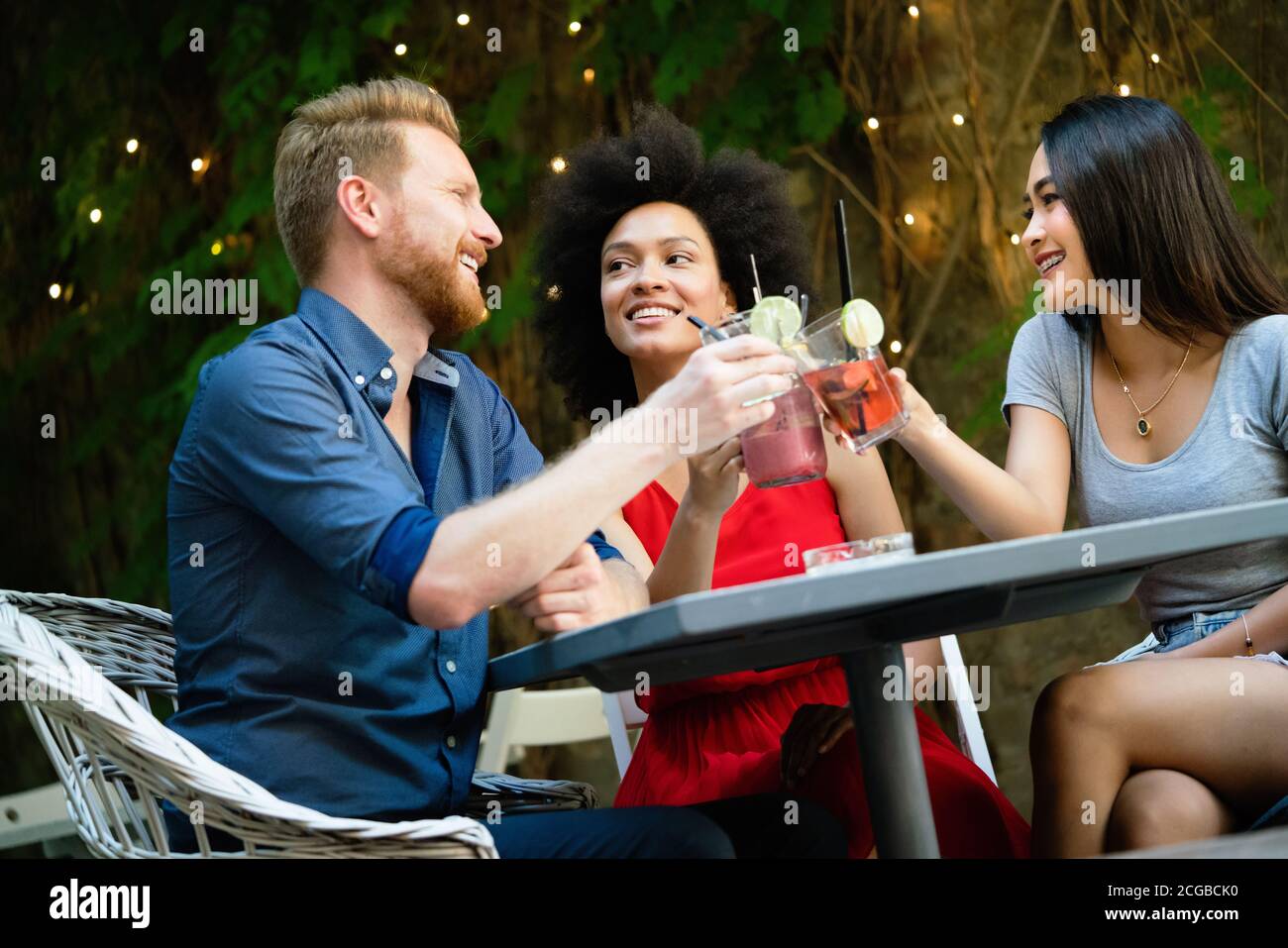 Young diverse friends having outdoor hi-res stock photography and ...