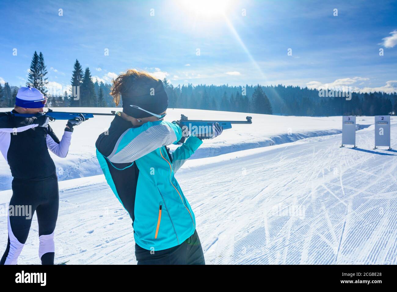A group of sporty young people doing a biathlon competition Stock Photo ...