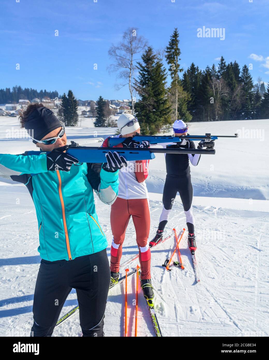 A group of sporty young people doing a biathlon competition Stock Photo ...