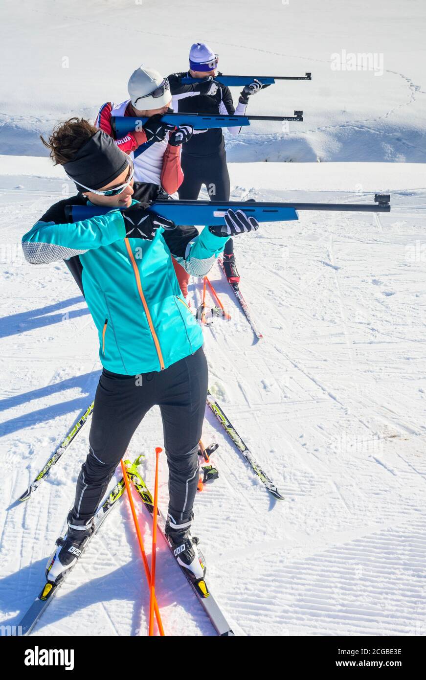 A group of sporty young people doing a biathlon competition Stock Photo ...