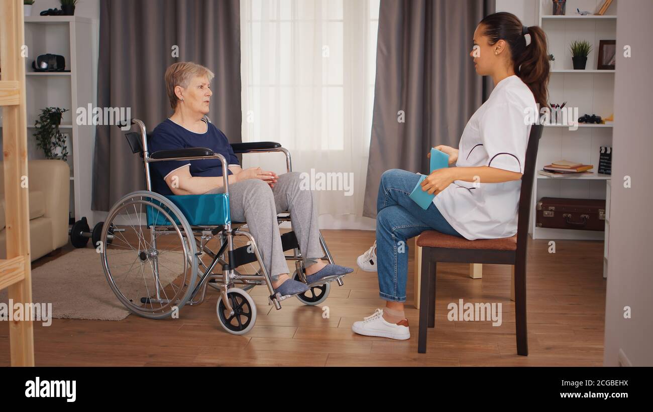 Wheelchair assistance lifting hi-res stock photography and images - Alamy