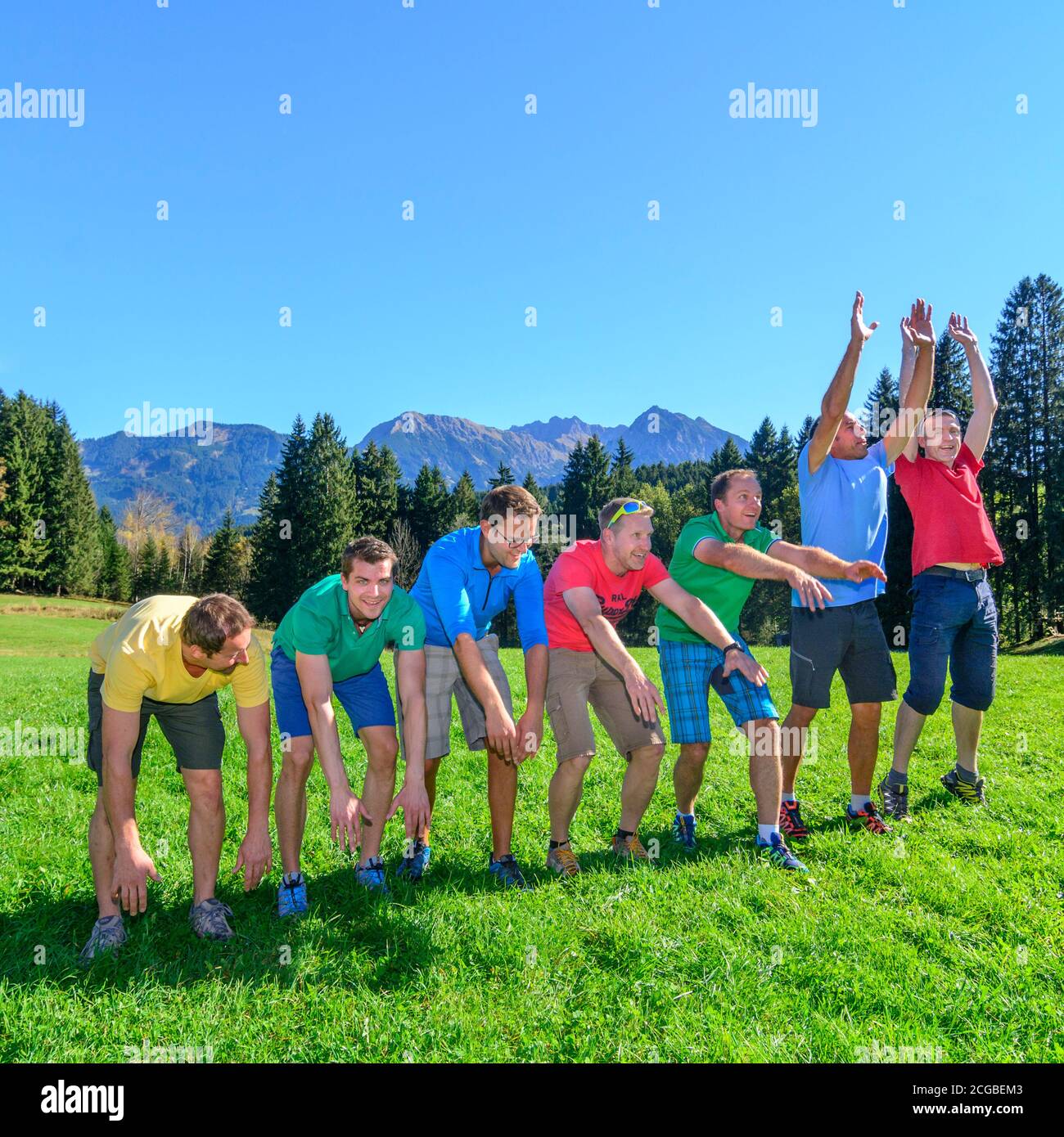 A large group of people celebrating their successful team training ...