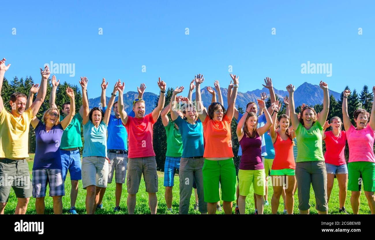 A large group of people celebrating their successful team training ...
