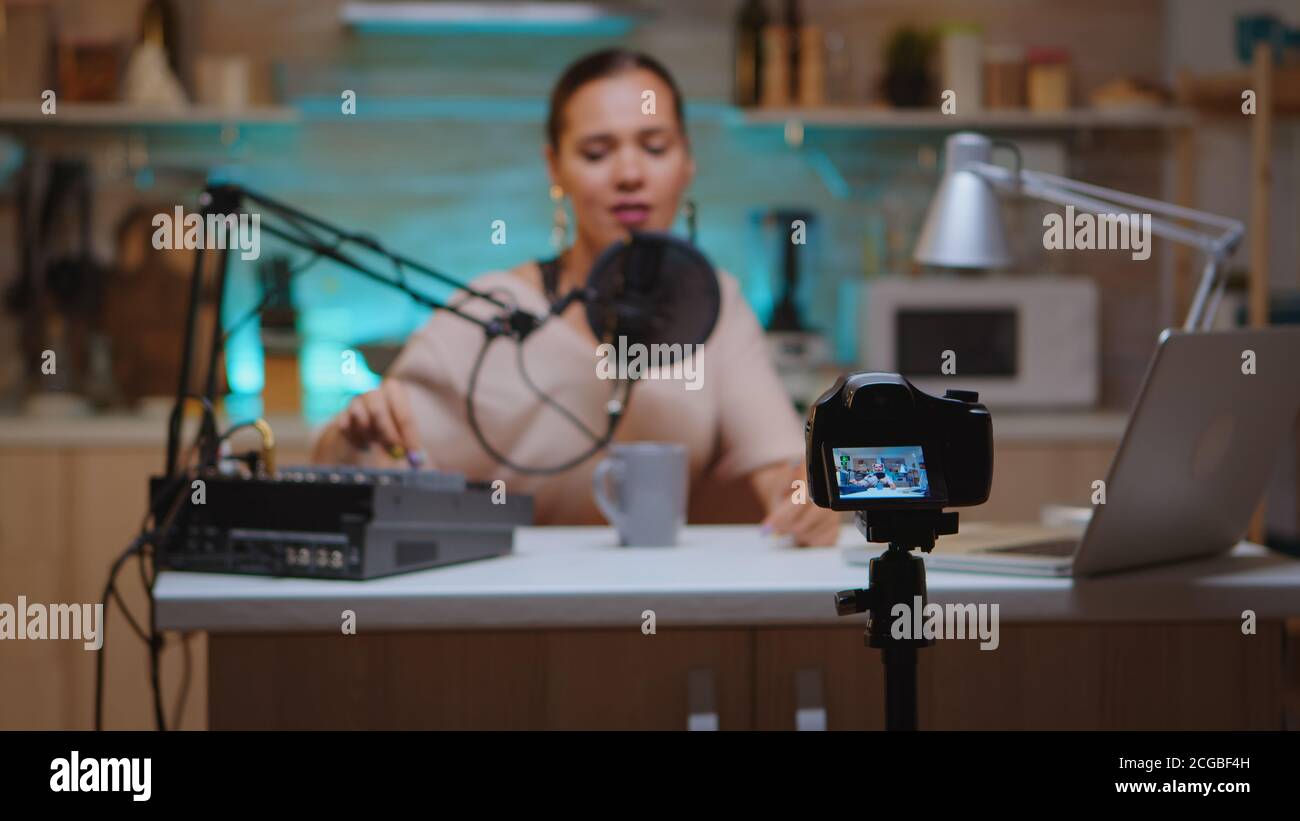 Influencer sitting at vlog station while camera is recording.. Creative ...