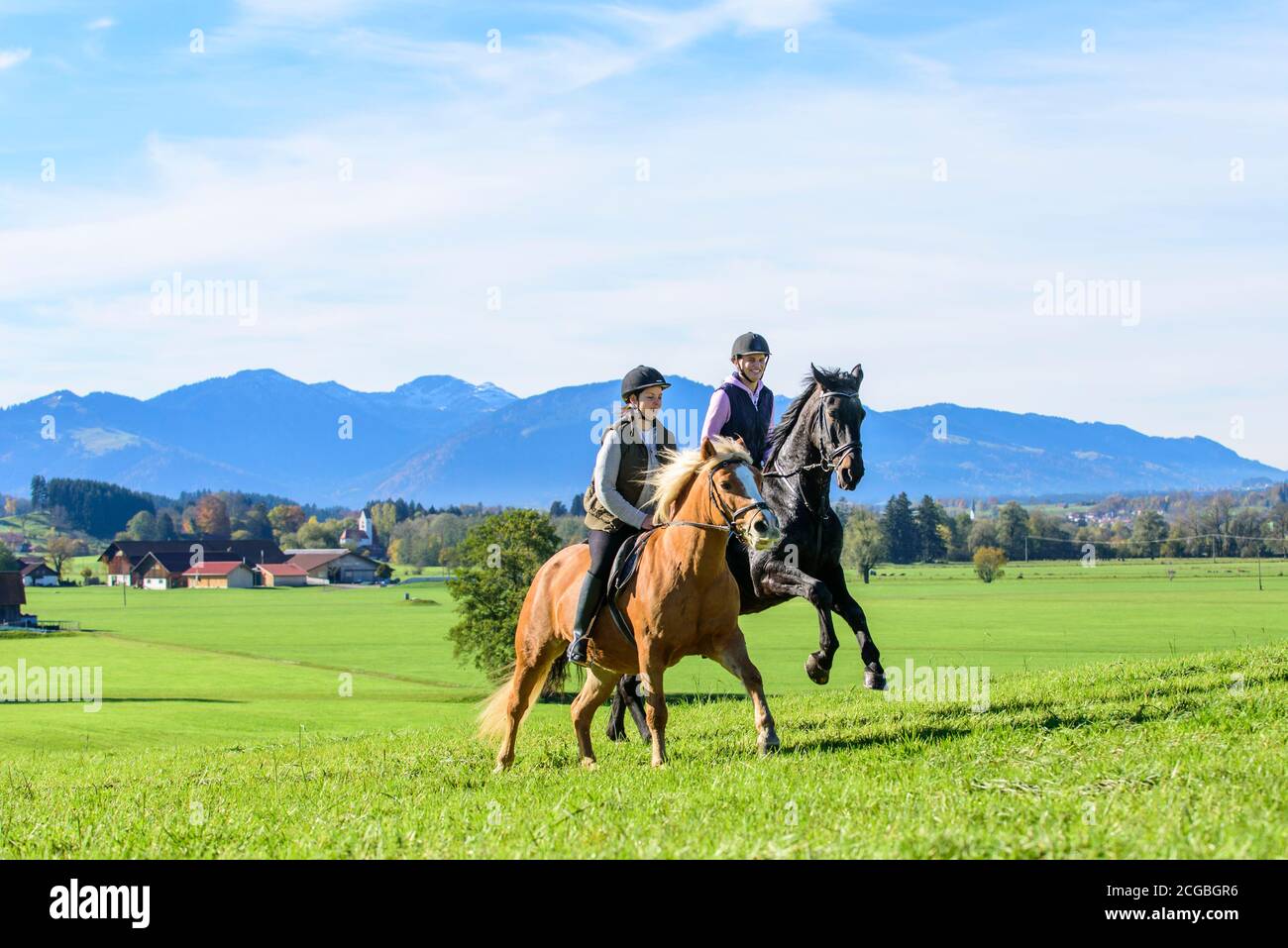 Two attractive women riding in hi-res stock photography and images - Alamy