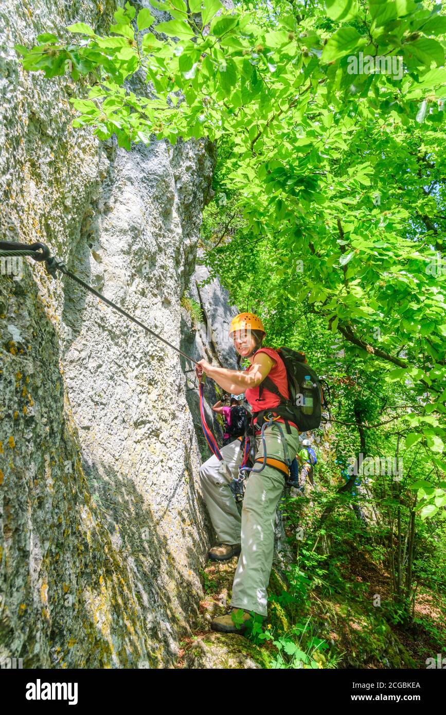 Hiking and climbing on a forestry and rocky trail with via ferrata ...