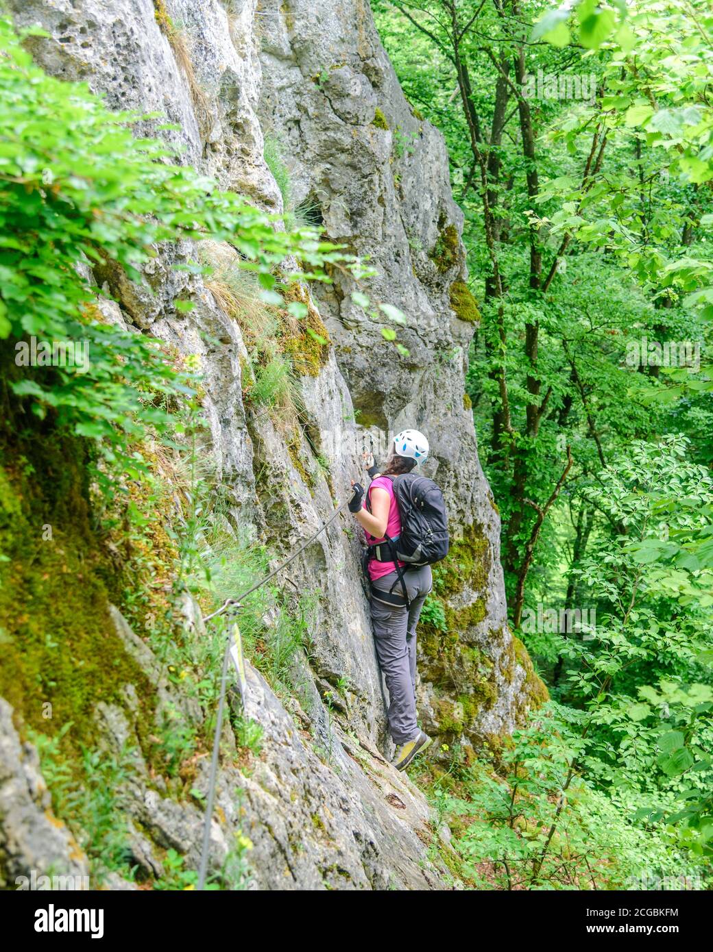 Hiking and climbing on a forestry and rocky trail with via ferrata ...