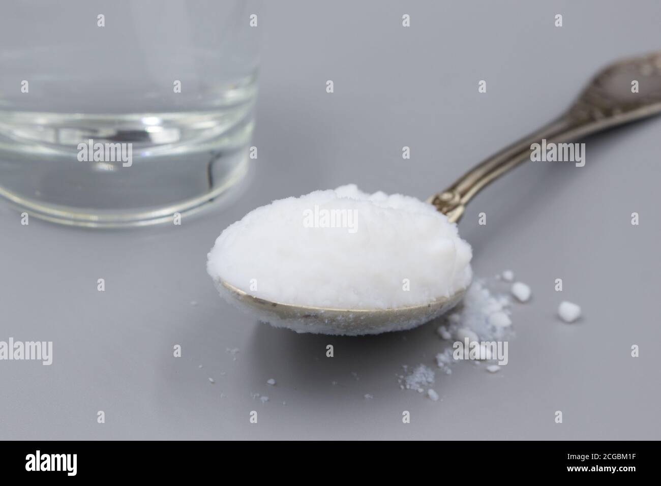 Transparent glass glass with water and white sorbent powder for ...