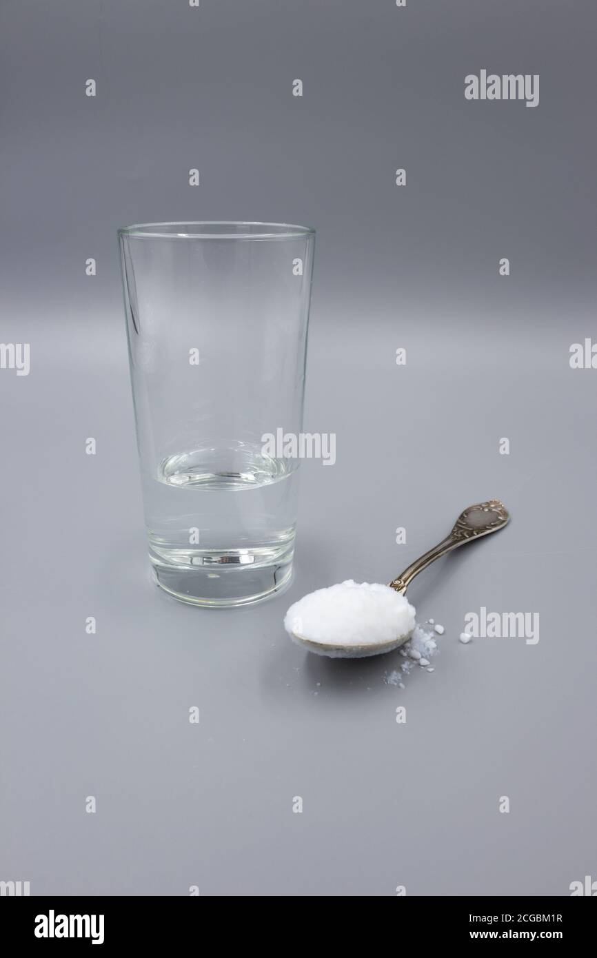 Transparent glass glass with water and white sorbent powder for ...