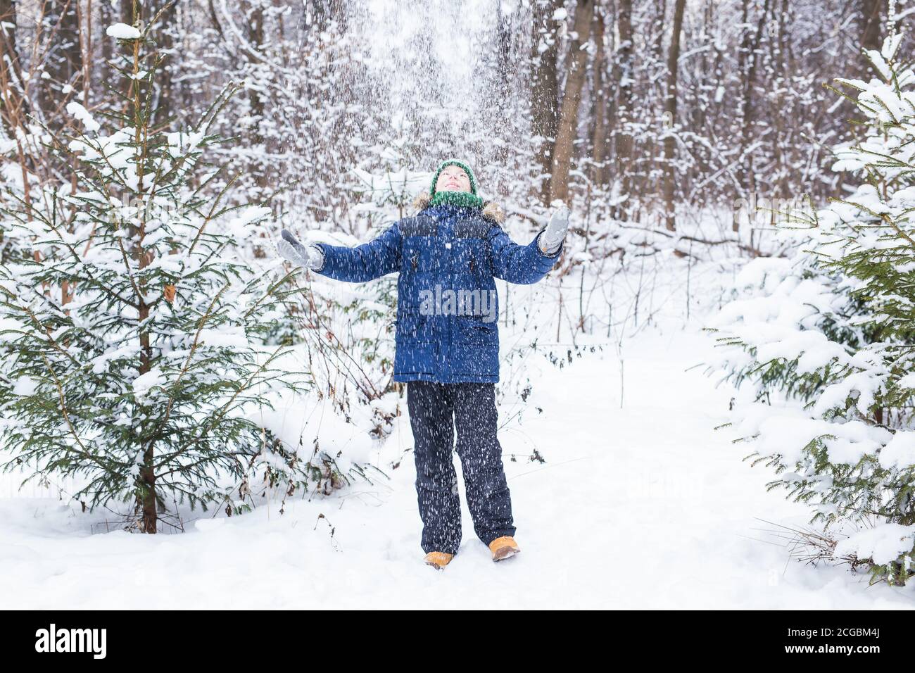 Happy boy throwing snow. Child, season and winter concept Stock Photo ...