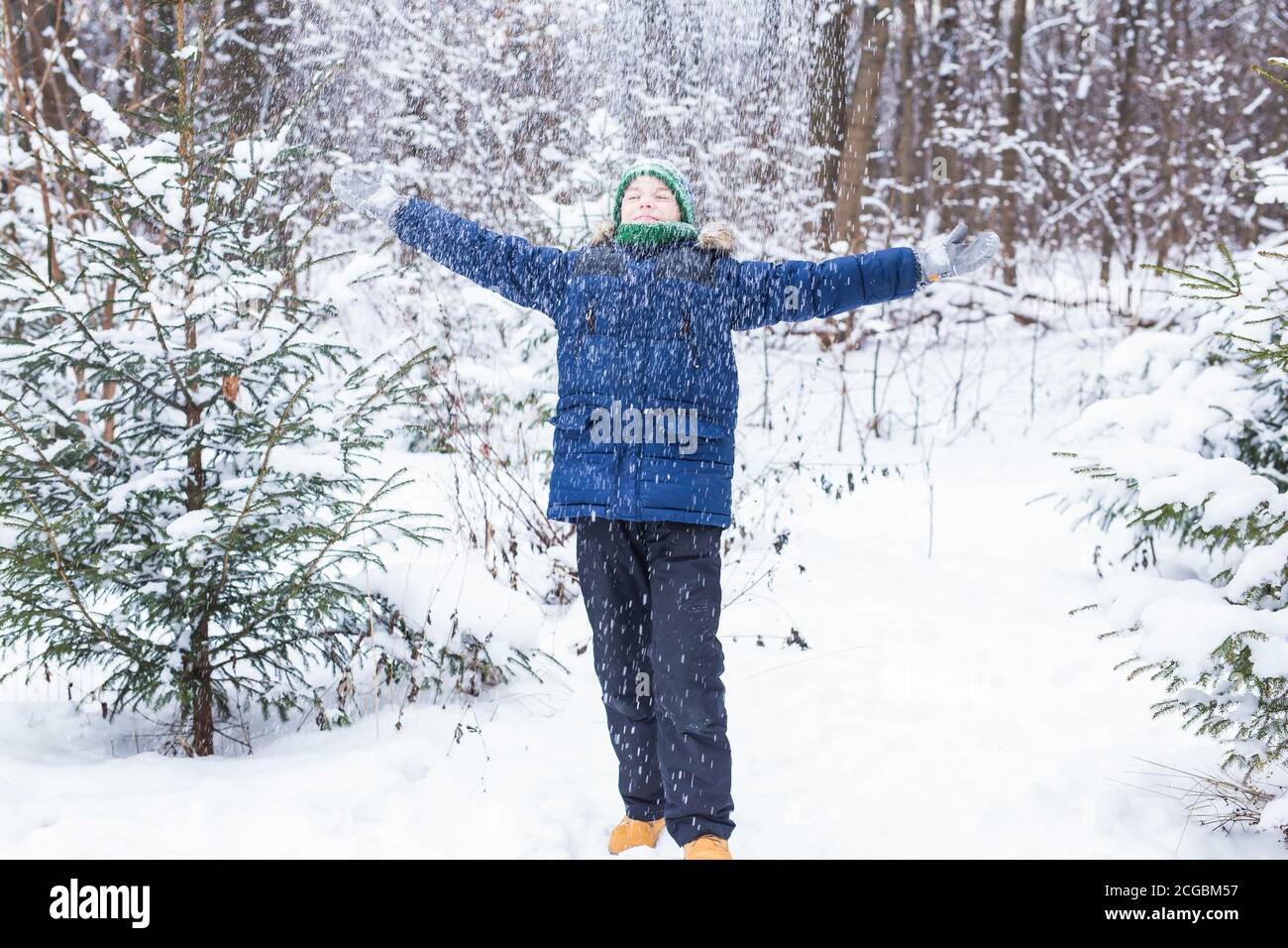 Happy boy throwing snow. Child, season and winter concept Stock Photo ...
