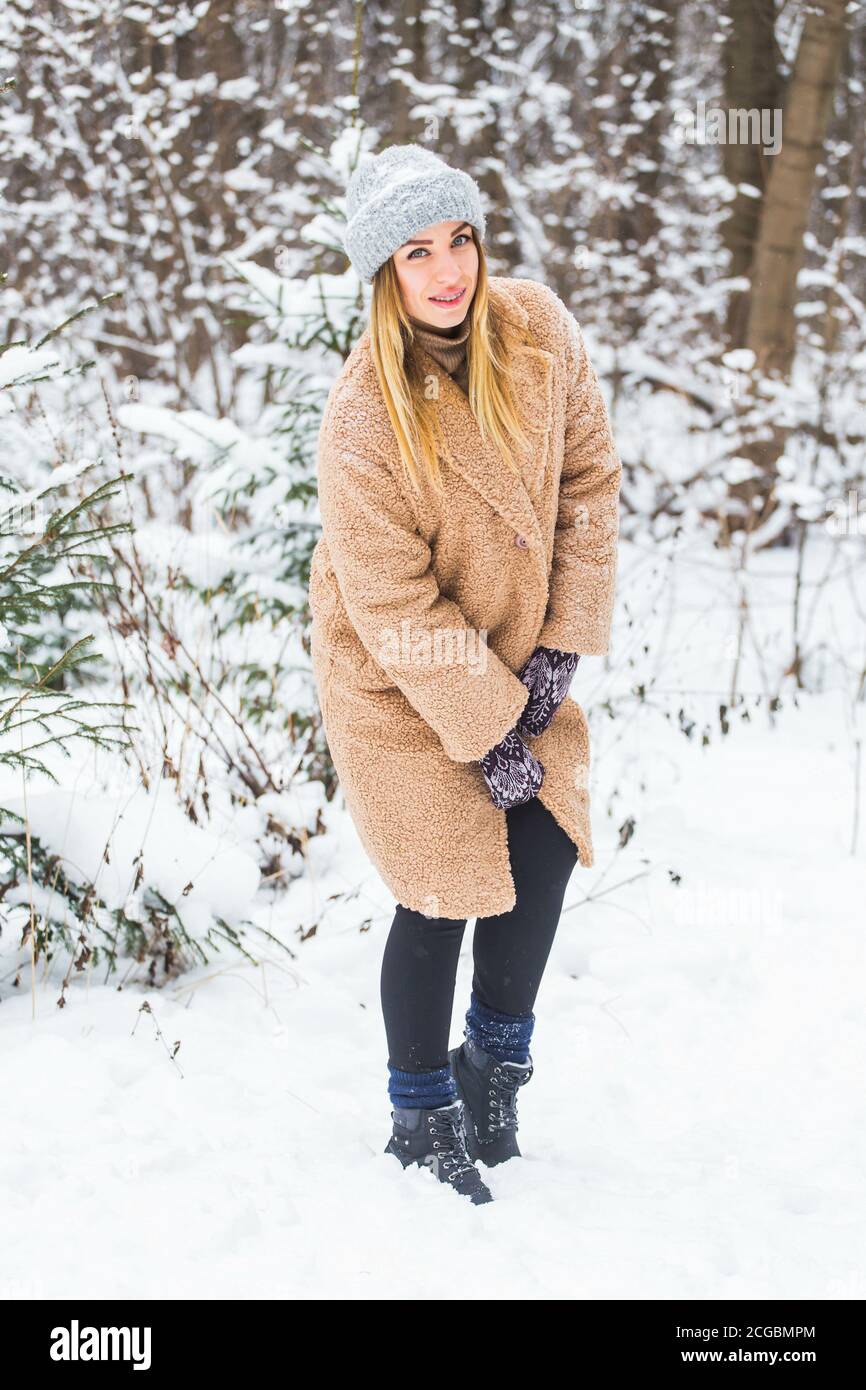 Attractive young woman in winter time outdoor. Snow, holidays and ...