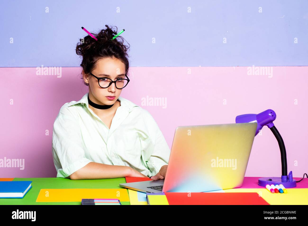 Female college student in a classroom. Funny female student studying ...