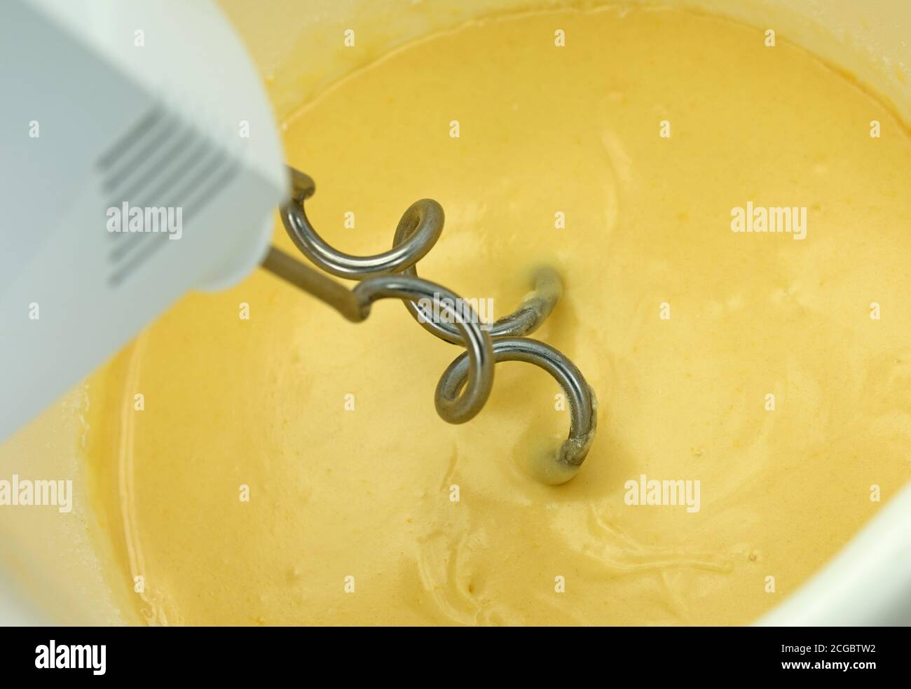 Hand mixing ingredients flour in hi-res stock photography and images ...