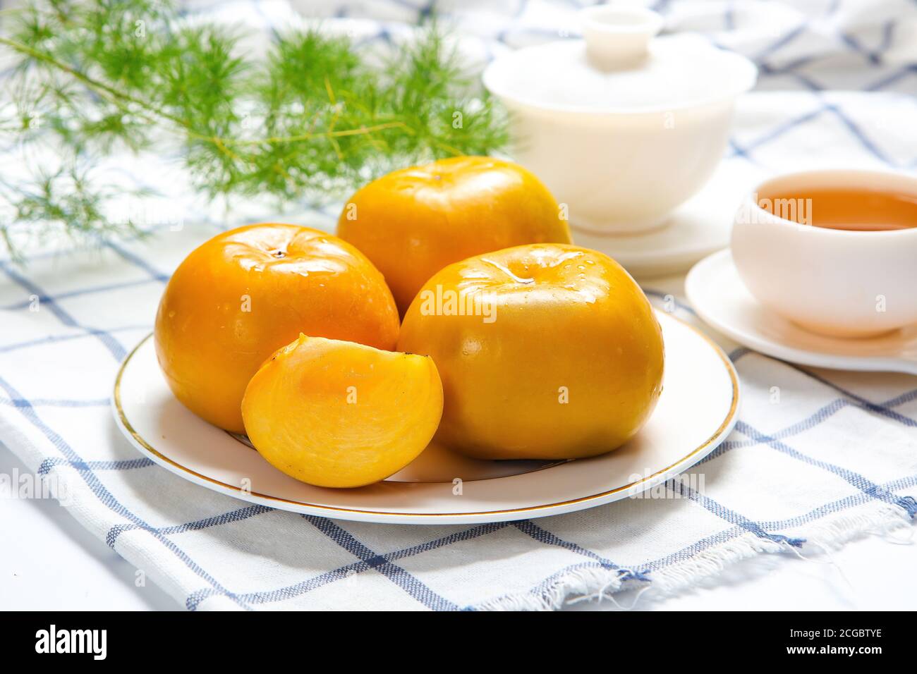 Persimmon drink nutrition afternoon tea Stock Photo - Alamy