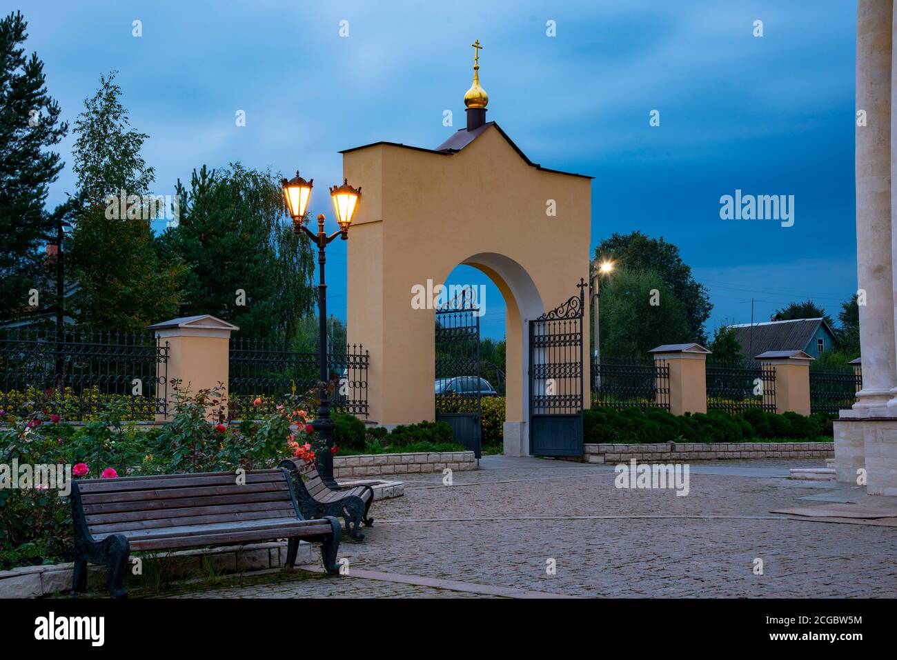 Beautiful arched gates and a fence enclosing the temple. The inner ...