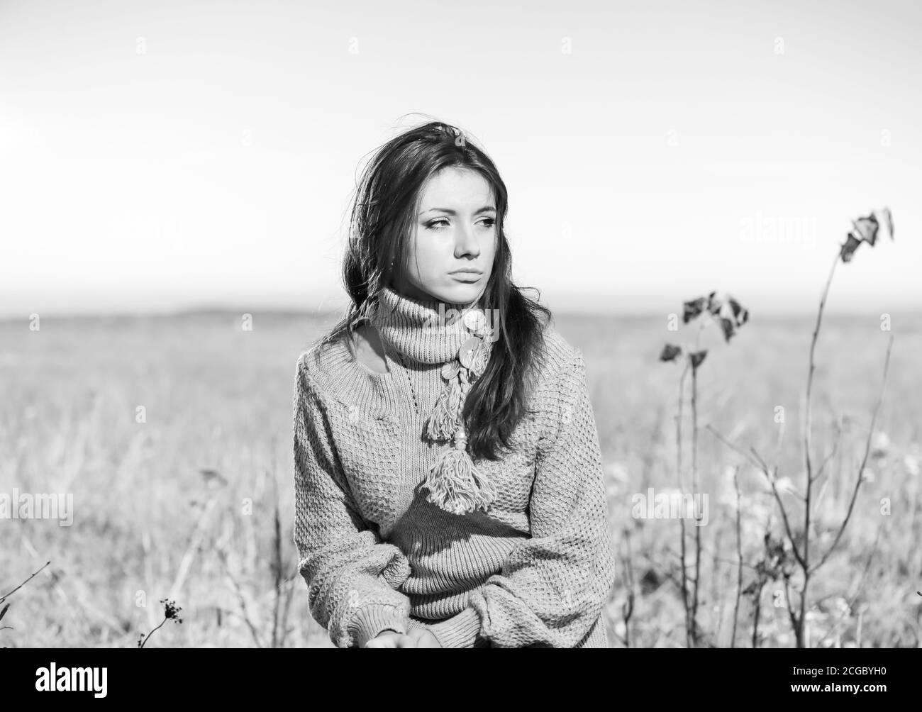 Sad girl portrait at fall season meadow Stock Photo - Alamy