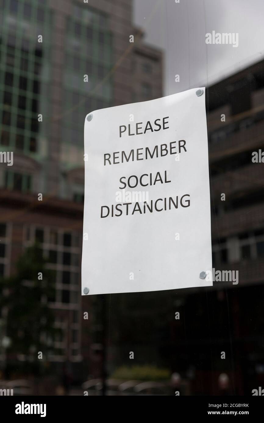 Please remember social distancing sign Stock Photo - Alamy