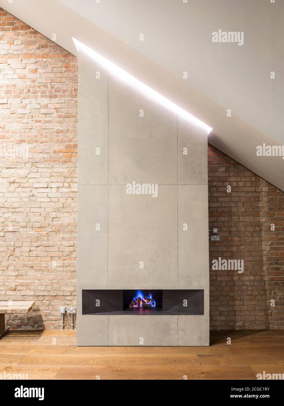 Fireplace in the living room of a refurbished top floor flat of a large ...